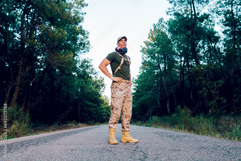 Low angle of Male commando with American flag wrapped around neck and ...