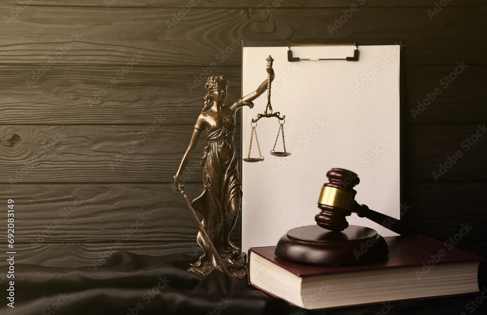 Lady justice or justitia the Roman goddess of Justice. Statue on brown ...