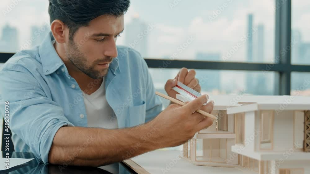 Vidéo Stock Professional engineer looking at blueprint while measure ...