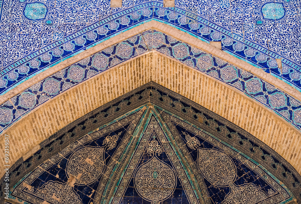 Ancient facade of a mosque made of brick with cladding in the ancient ...