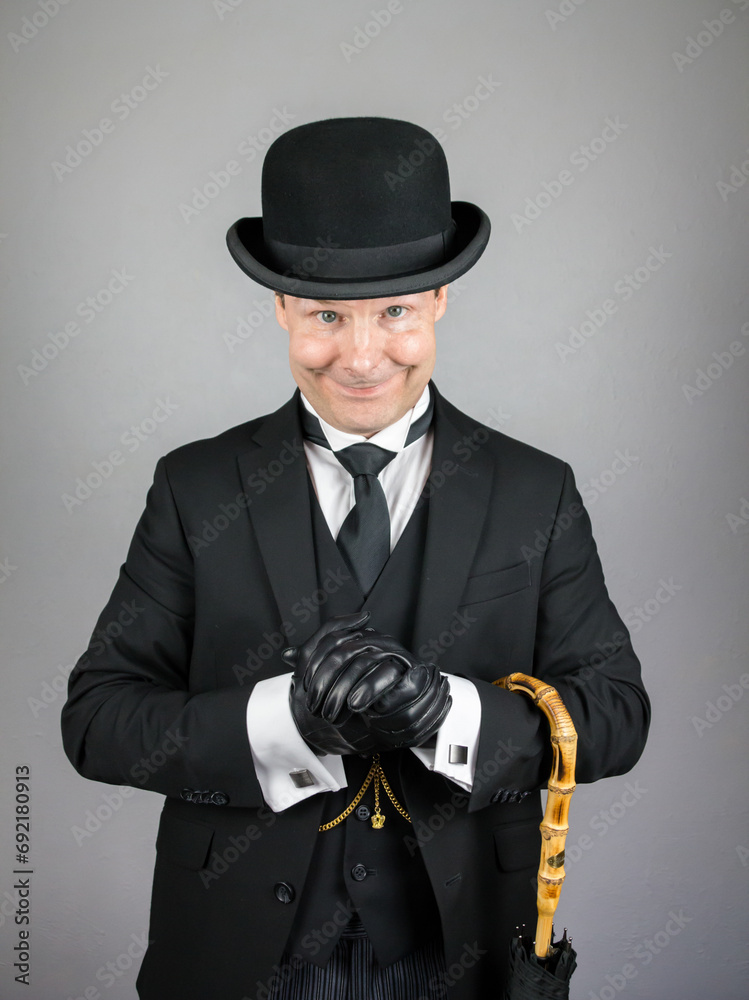 Portrait of Smiling British Businessman in Dark Suit and Bowler Hat ...