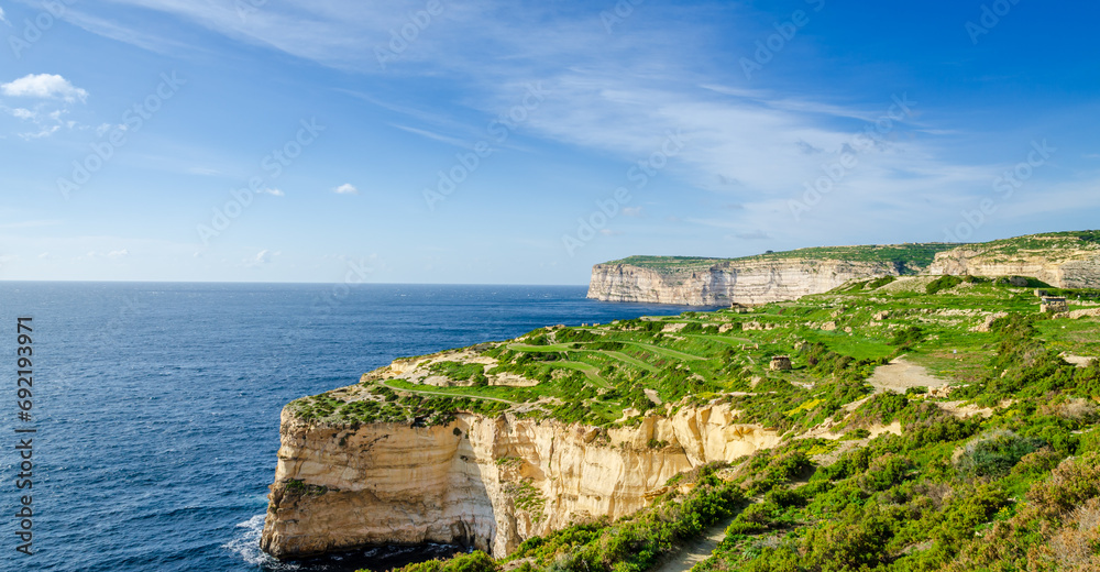 Rocky limestone coastline of Gozo island and Mediterranean Sea with ...