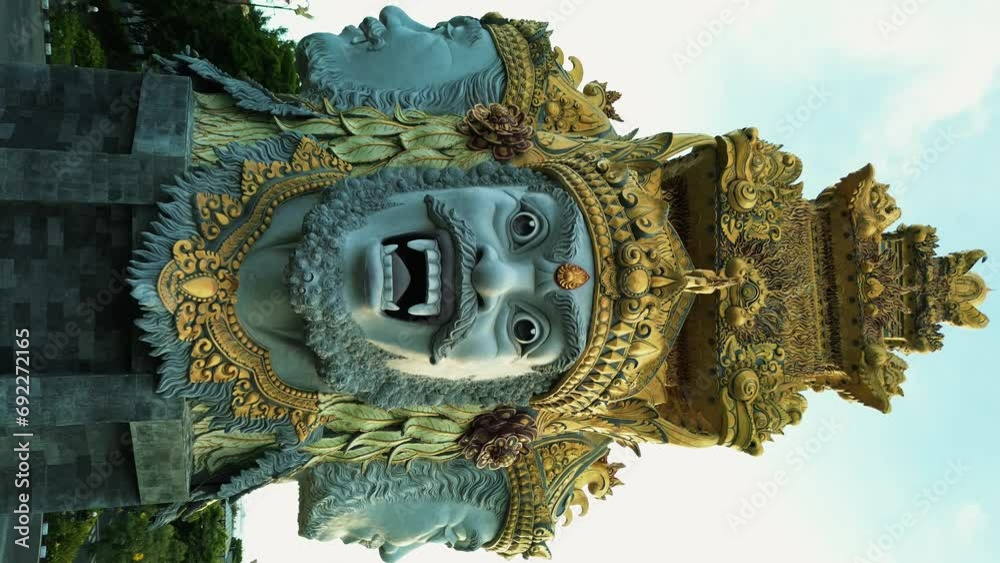 Vertical aerial view of the incredible and detailed statue in Benoa on ...
