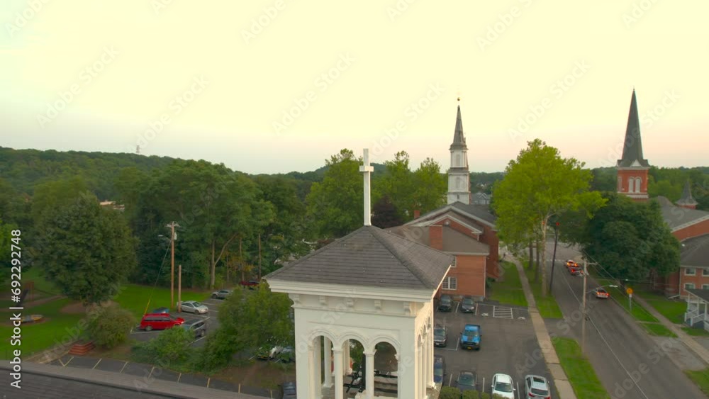 Aerial rotate around a church cross in Downtown Palmyra in New York ...
