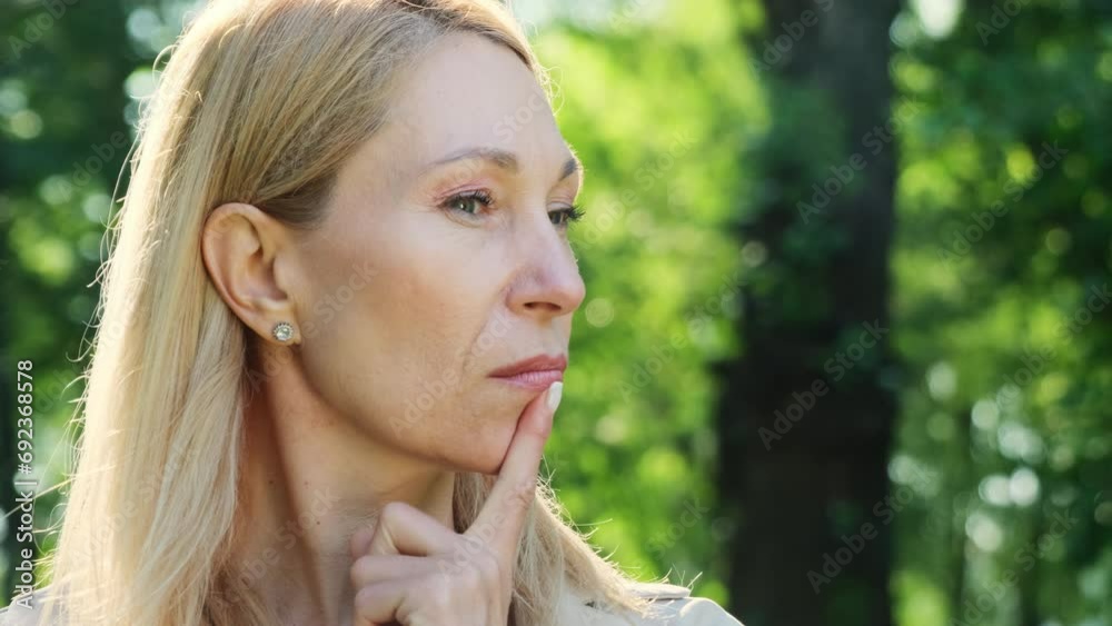 Eye-catchy blonde lady looks puzzled. Reflecting on important matters ...