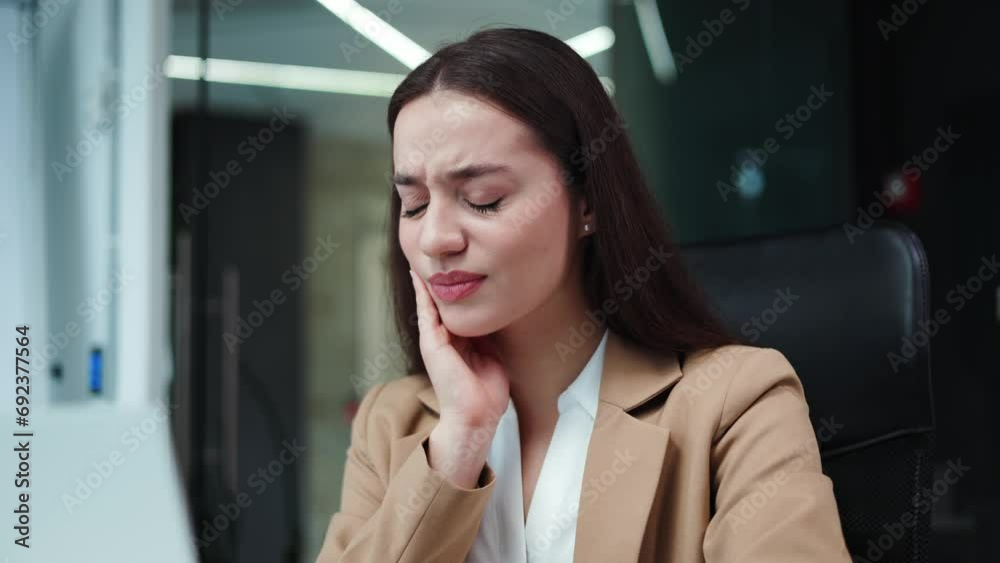Dark haired caucasian lady feeling severe toothache during working ...