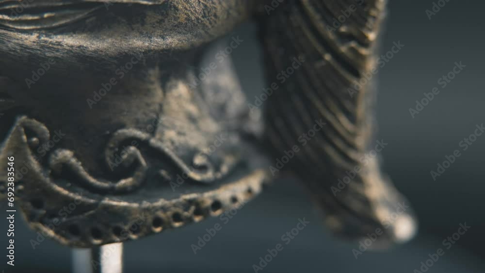 A close up macro detailed shot from behind of a spartan face design ...