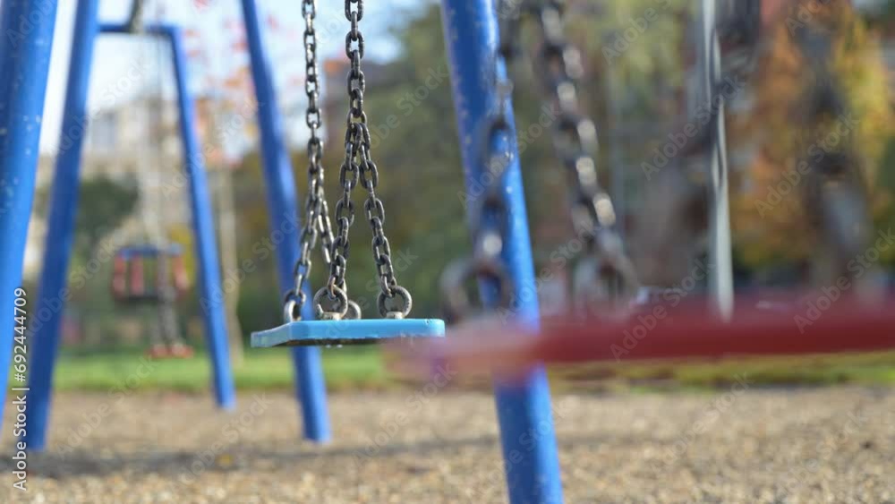 Empty swing on park playground, concept of child abduction or ...