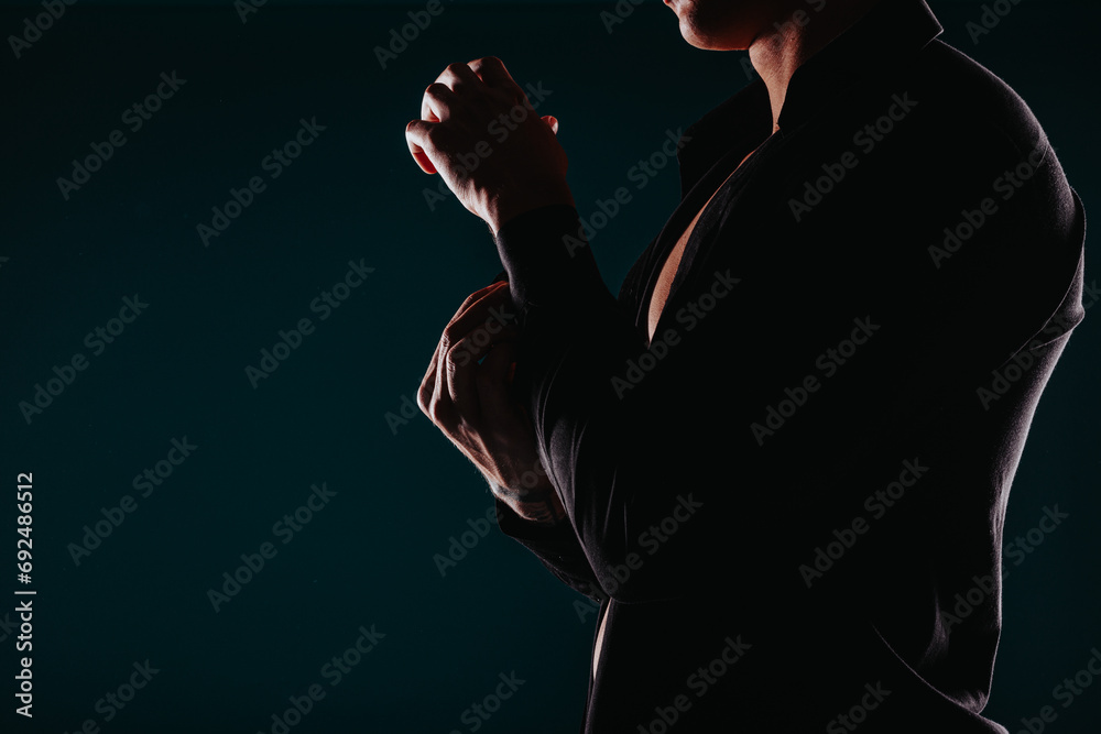 Confident fitness model showing muscular physique, flexing muscles in ...