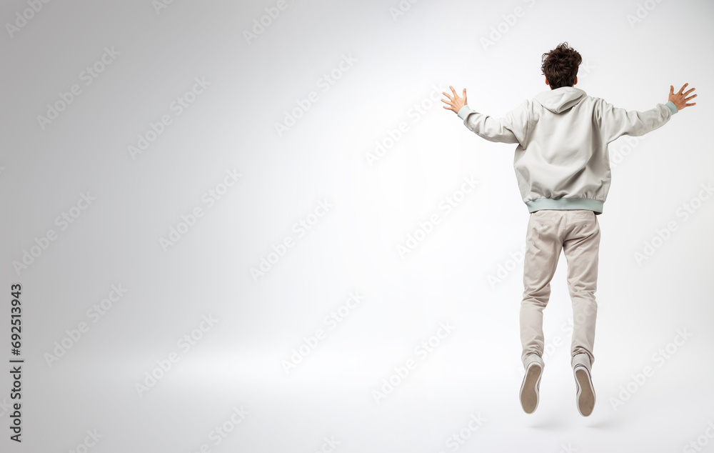 teen man jumping - leaping for joy - happiness and freedom concept ...