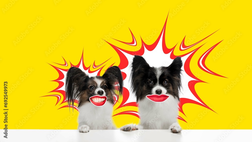 Two purebred little dogs with female mouth, lips looking against yellow ...