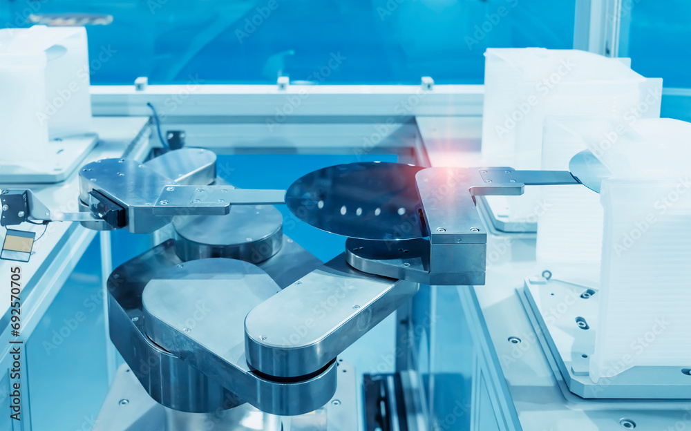 automate robot arm with silicon wafers and microcircuits and Automation system control ...