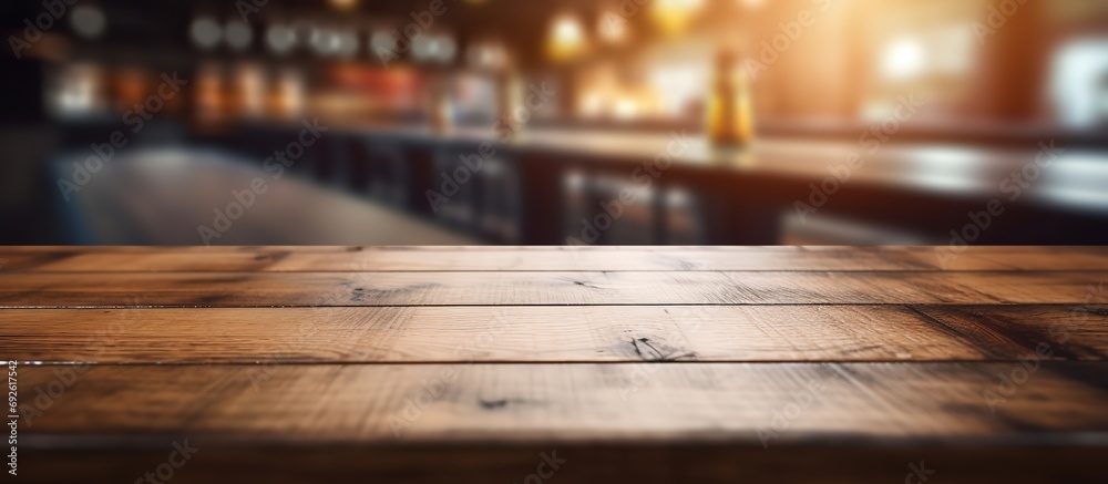 rustic countryside bar background with wooden table board foreground ...