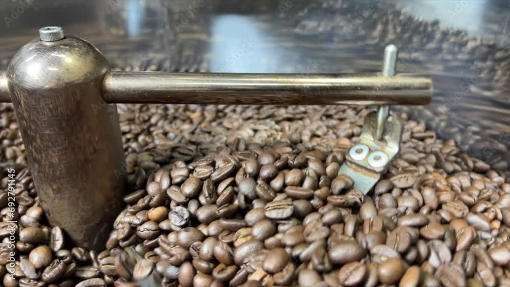 Freshly roasted coffee beans in the state-of-the-art roasting machine ...