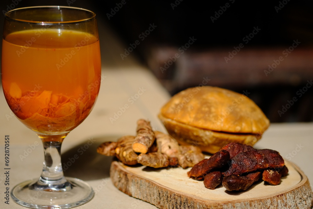 Jamu Kunir Asem is is a traditional Javanese herbal drink made from ...