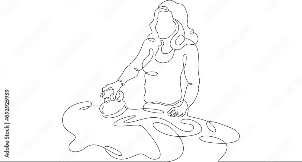 Seamstress at work in the studio. A dressmaker sews. A young woman ...