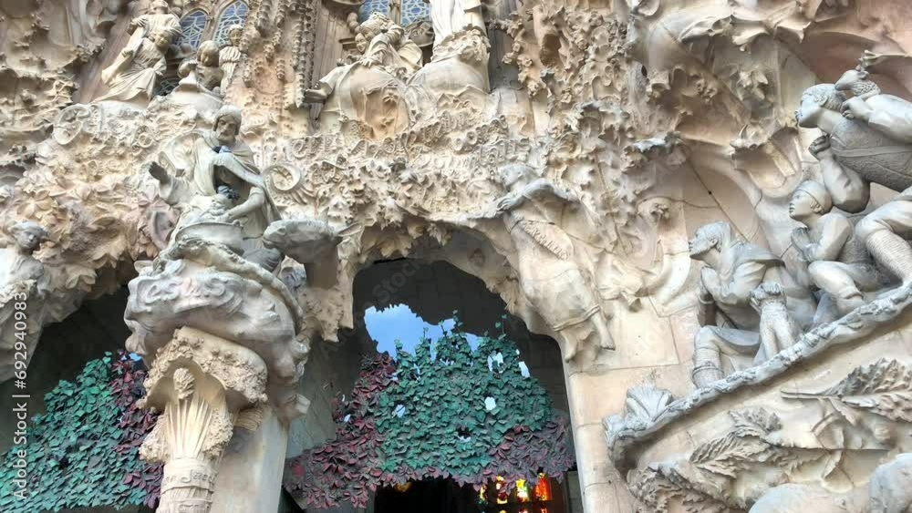 Detail of Sagrada Familia's Nativity portal. Slow motion pan up ...