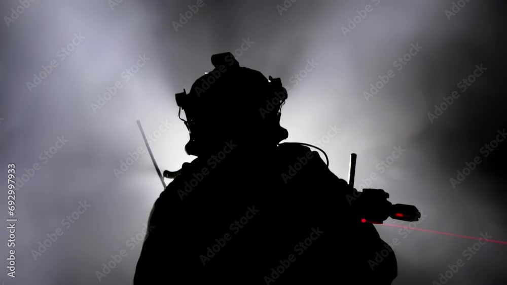 Silhouette military soldier, warrior aims by weapon assault rifle ...