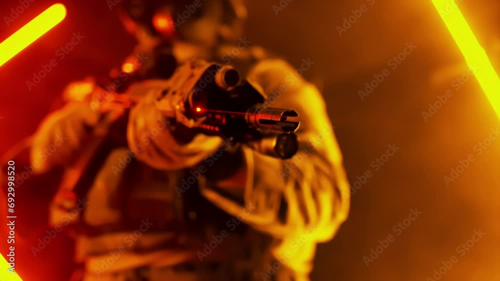Focus on tactical red laser sight mounted on weapon assault rifle ...