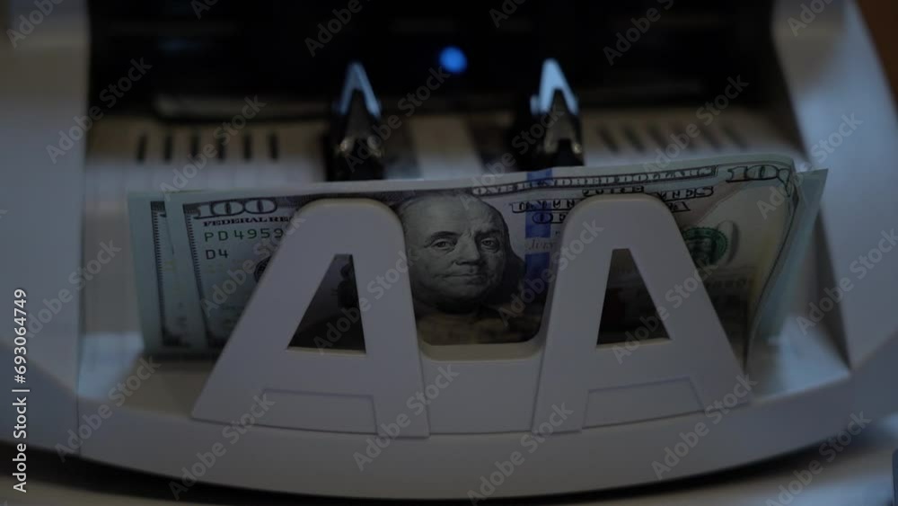 Counting machine for banknotes. American money in a counting machine ...