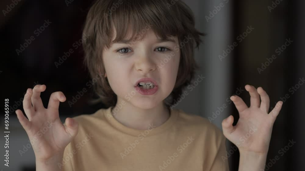 Vídeo do Stock: Funny Child with Angry Scary Face and Hands. Young Cute ...