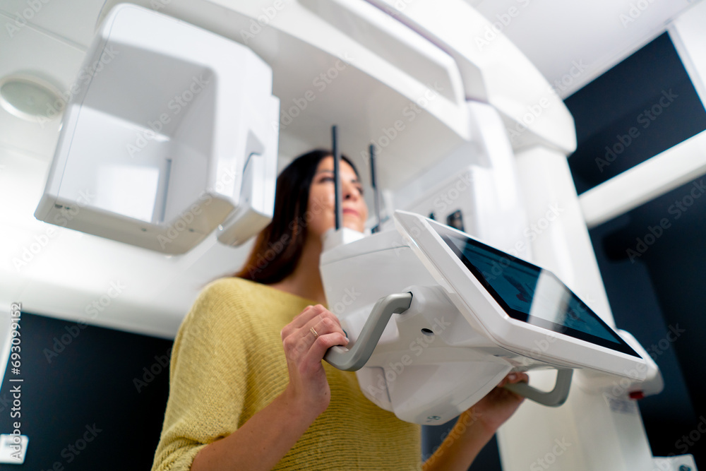 portrait of a beautiful woman doing a 3D scan of the nose and oral ...