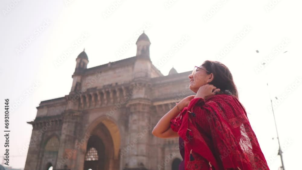 Indian teenager girl looking at famous Gateway of India in Mumbai ...