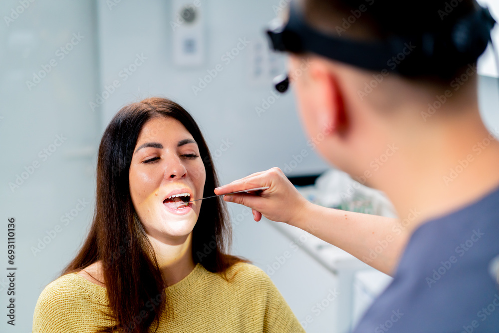 the ENT doctor examines the patient in the office of the clinic, checks ...