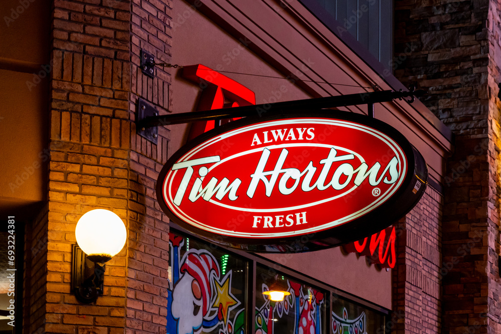 Tim Hortons logo sign on the building at dusk. Niagara Falls, Ontario ...