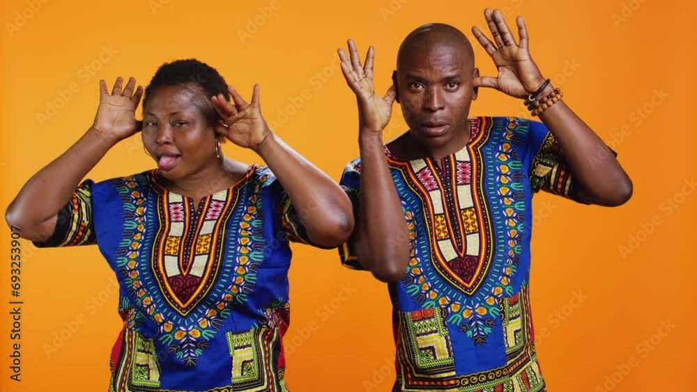 African american silly couple fooling around on camera, sticking tongue ...