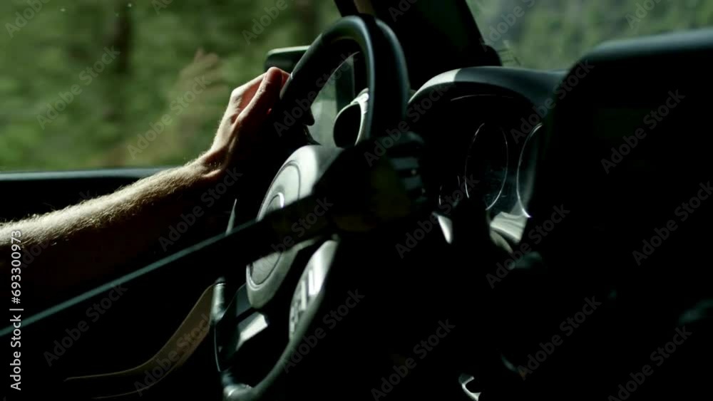 Human with artificial robotic arm holding steering wheel and driving ...
