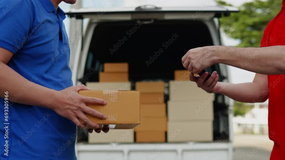 Delivery man, driver in red orange uniform is sending parcel box ...