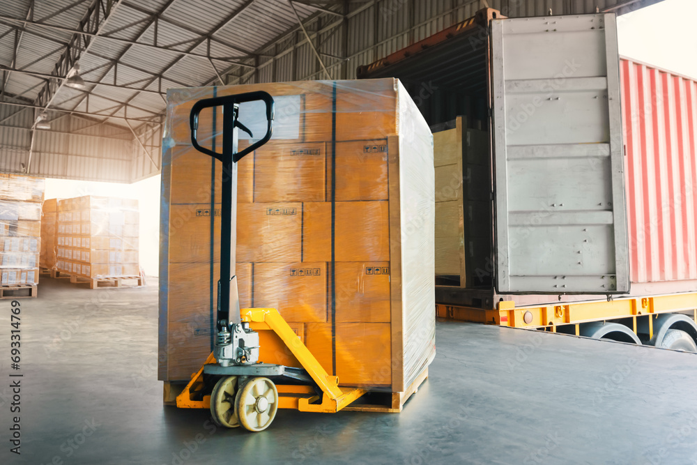 Package Boxes Wrapped Plastic Stacked on Pallets and Hand Pallet Truck ...