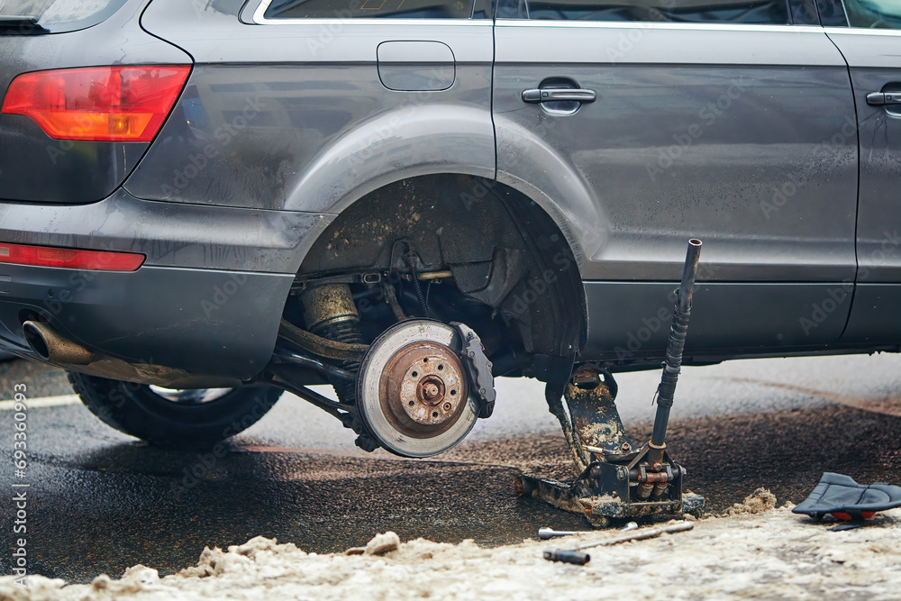 Car stoped at roadside, wheel puncture. Mobile puncture repair service ...