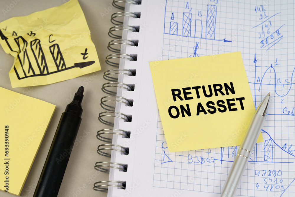 On the table there is a notepad with notes and sticky notes with the ...