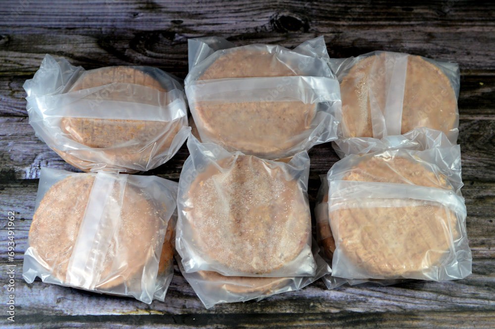 Raw uncooked beef burger ready to be cooked and fried in shallow oil ...