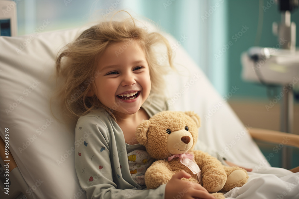 Little girl resting on a hospital bed in the pediatric ward ...