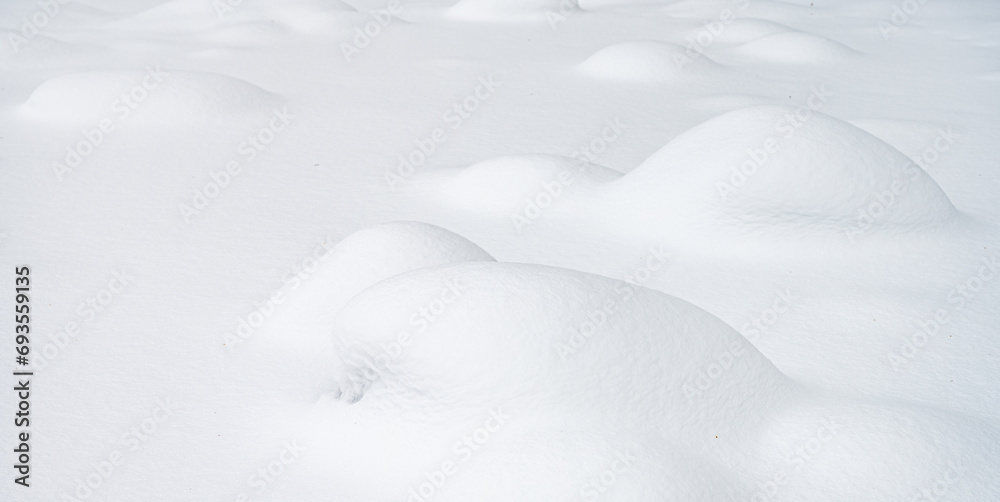Snowy landscape with rounded hills, smooth texture and untouched snow ...