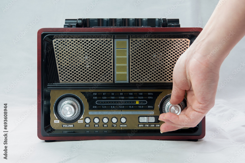 A Female Fingers Tuning the Frequency on an Old Vintage Analog Receiver ...