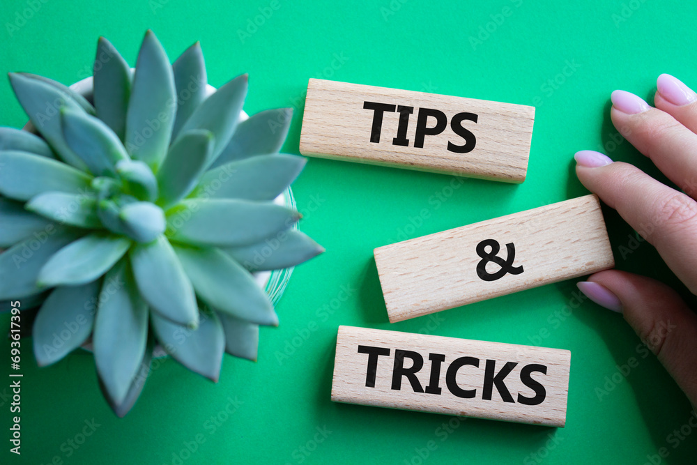 Tips and tricks symbol. Wooden blocks with words Tips and tricks ...