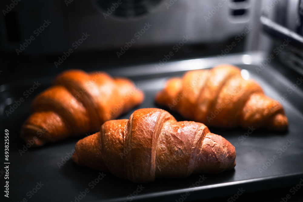 Croissants are baked in the home oven. Food photography Stock Photo ...