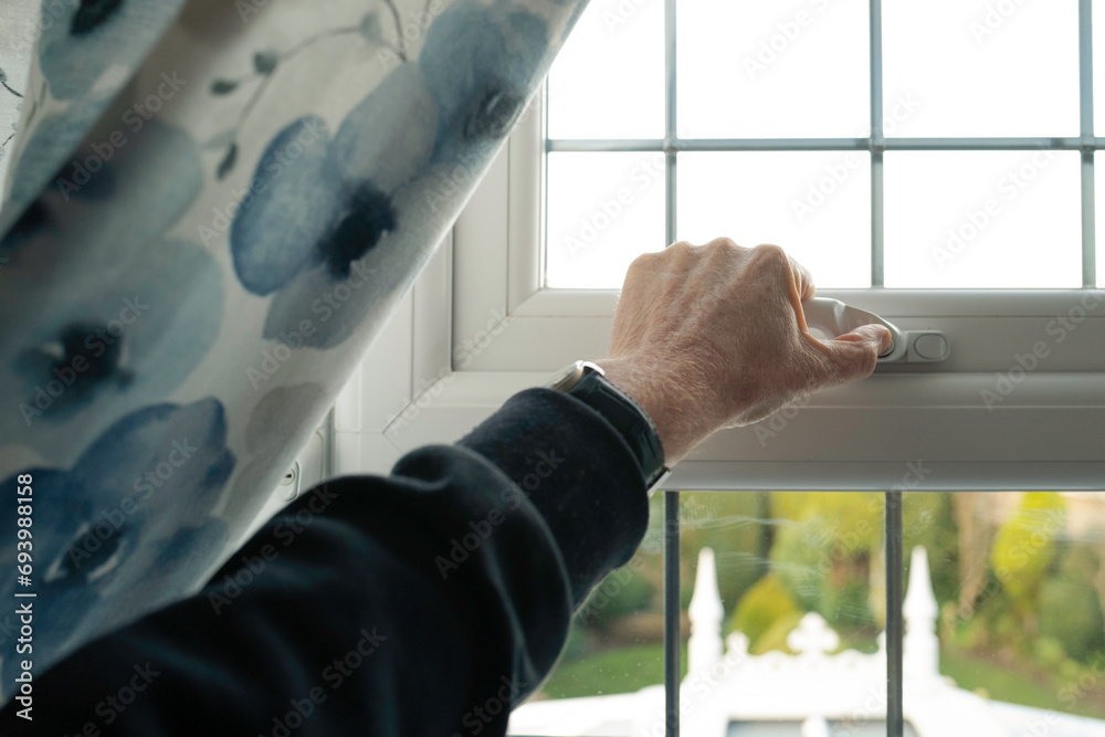 Home owner seen closing and locking a newly installed uPVC window. Part ...