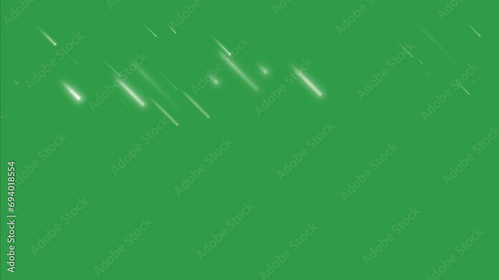 Shooting stars with twinkling lights gracefully fall on a green screen ...
