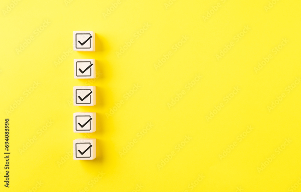 Checklist concept. Correct sign tick check mark on wooden block with ...