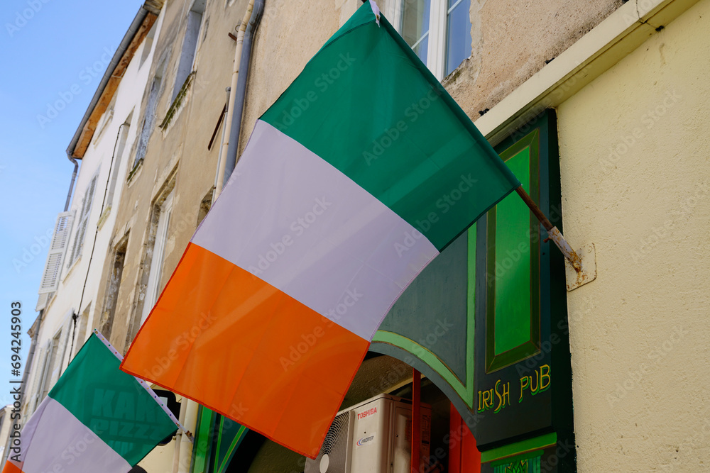 Bar facade irish orange white green flag of Ireland in wall entrance ...