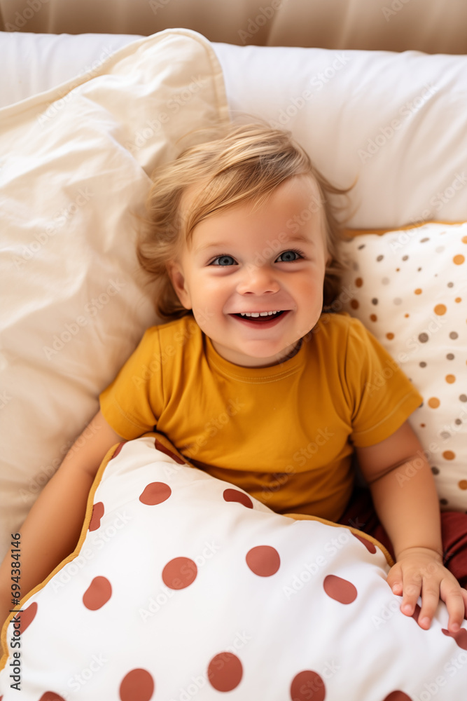 portrait of little smiling laughing baby child in bed cradle Stock ...