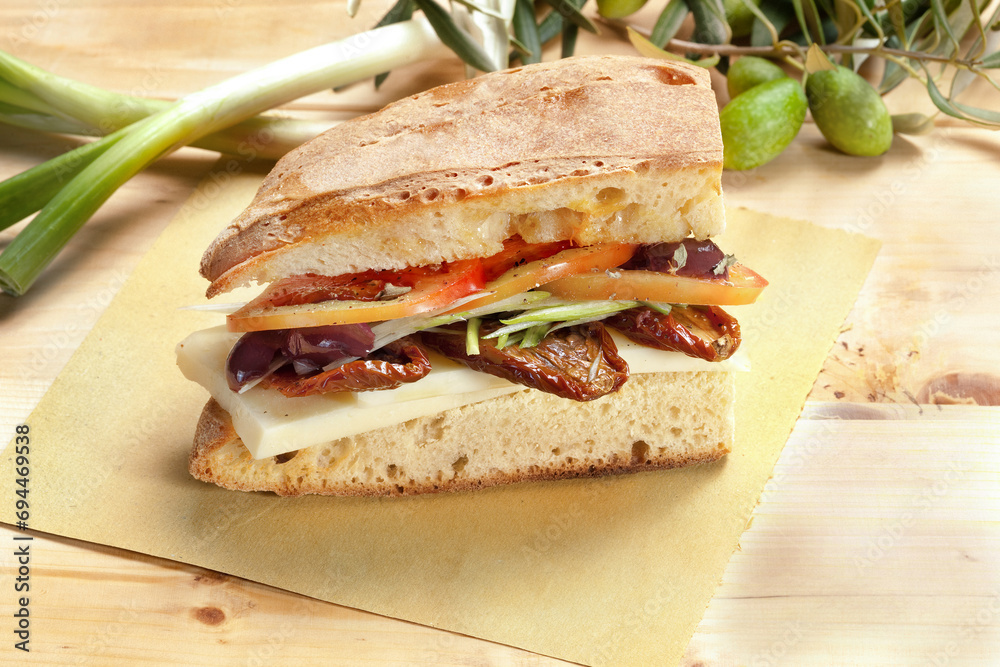 Typical seasoned Sicilian sandwich"Pane Condito", "Pani Cunzatu", or ...