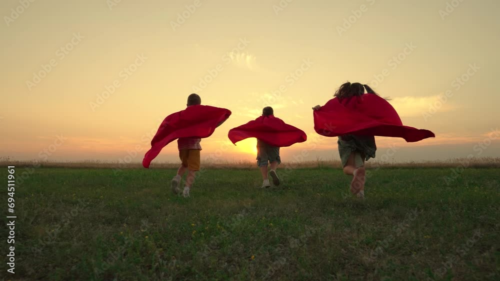 Boy, girl play red cape superhero, childhood dream. Child hero in red ...