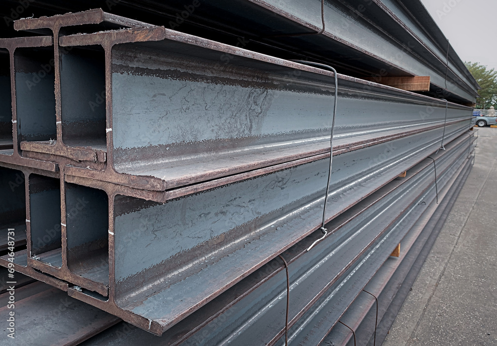 Metal profiled steel beams are packed at the metal products warehouse ...