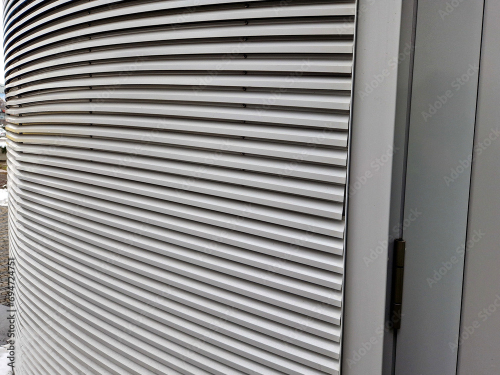 building is lined with square panels. metal sheet wall cladding with ...